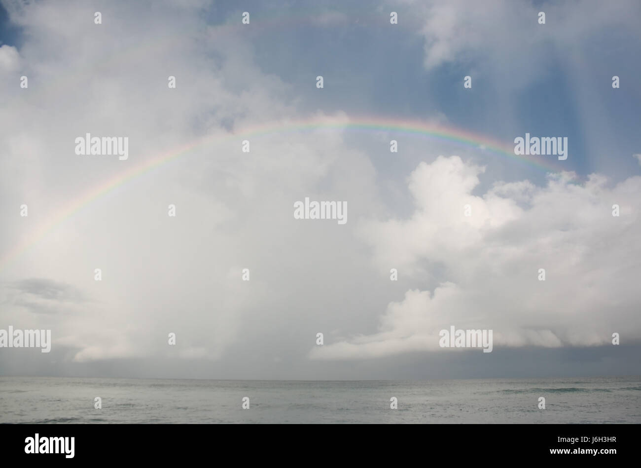 horizon rainbow artistic clouds firmament sky salt water sea ocean ...