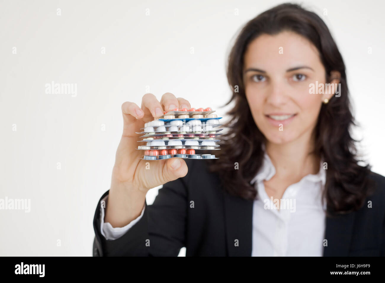 pretty woman with various pills Stock Photo - Alamy
