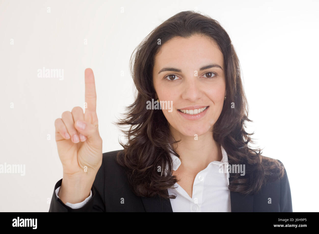 pointing with her finger the number one on Stock Photo - Alamy