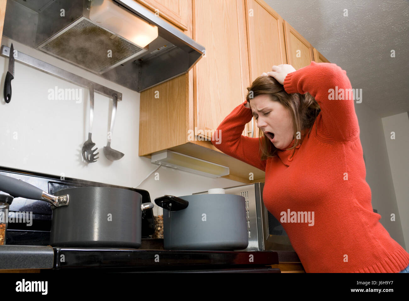 Woman cooking pot frustration hi-res stock photography and images - Alamy