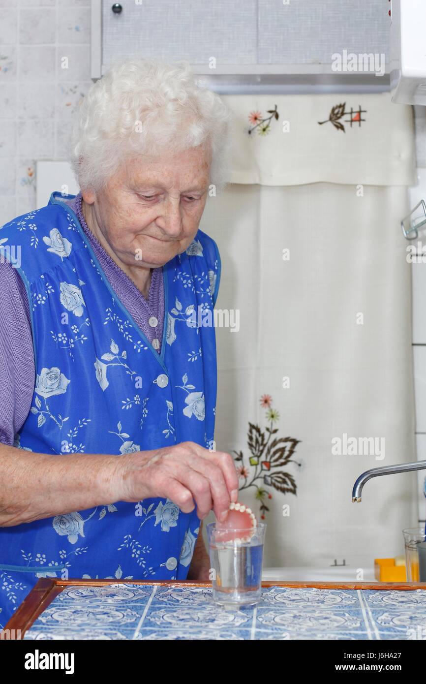 granny cleans teeth Stock Photo - Alamy