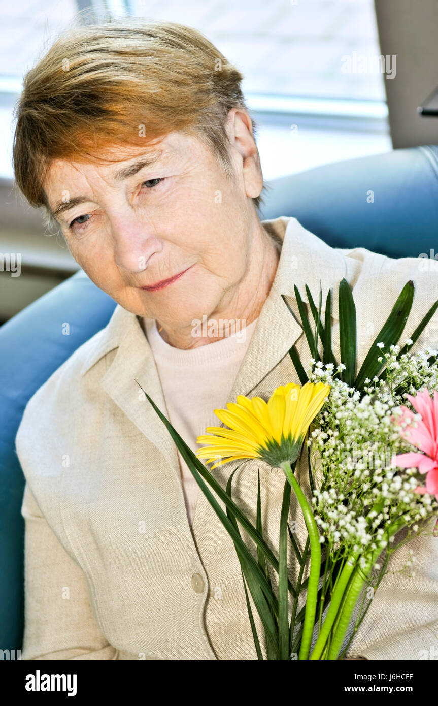 woman sad flower flowers plant bouquet possession holding old senior ...