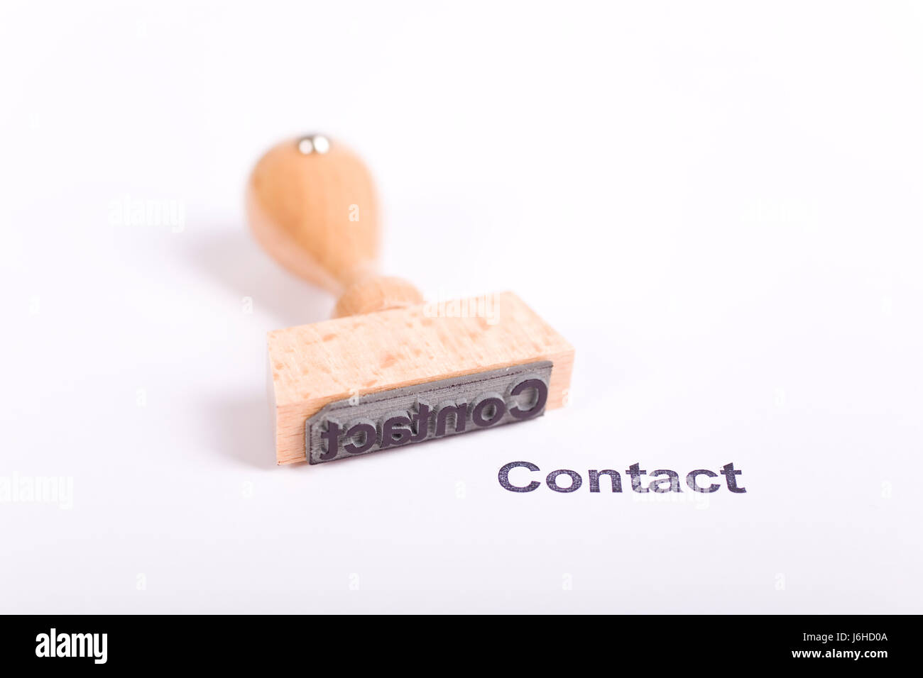 stamp made of wood with the word contact Stock Photo - Alamy