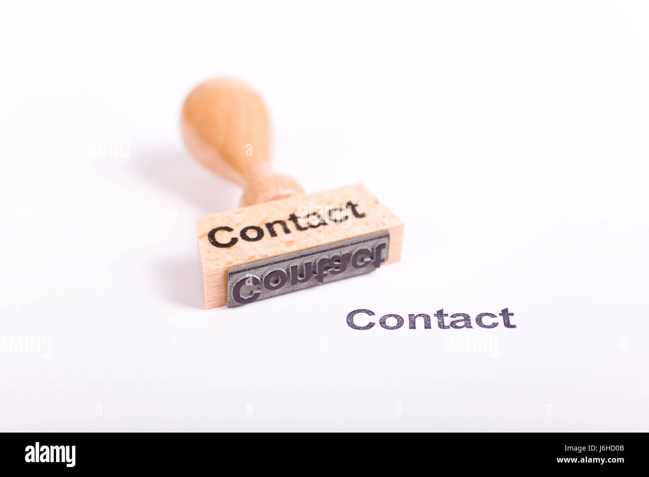stamp made of wood with the word contact Stock Photo - Alamy