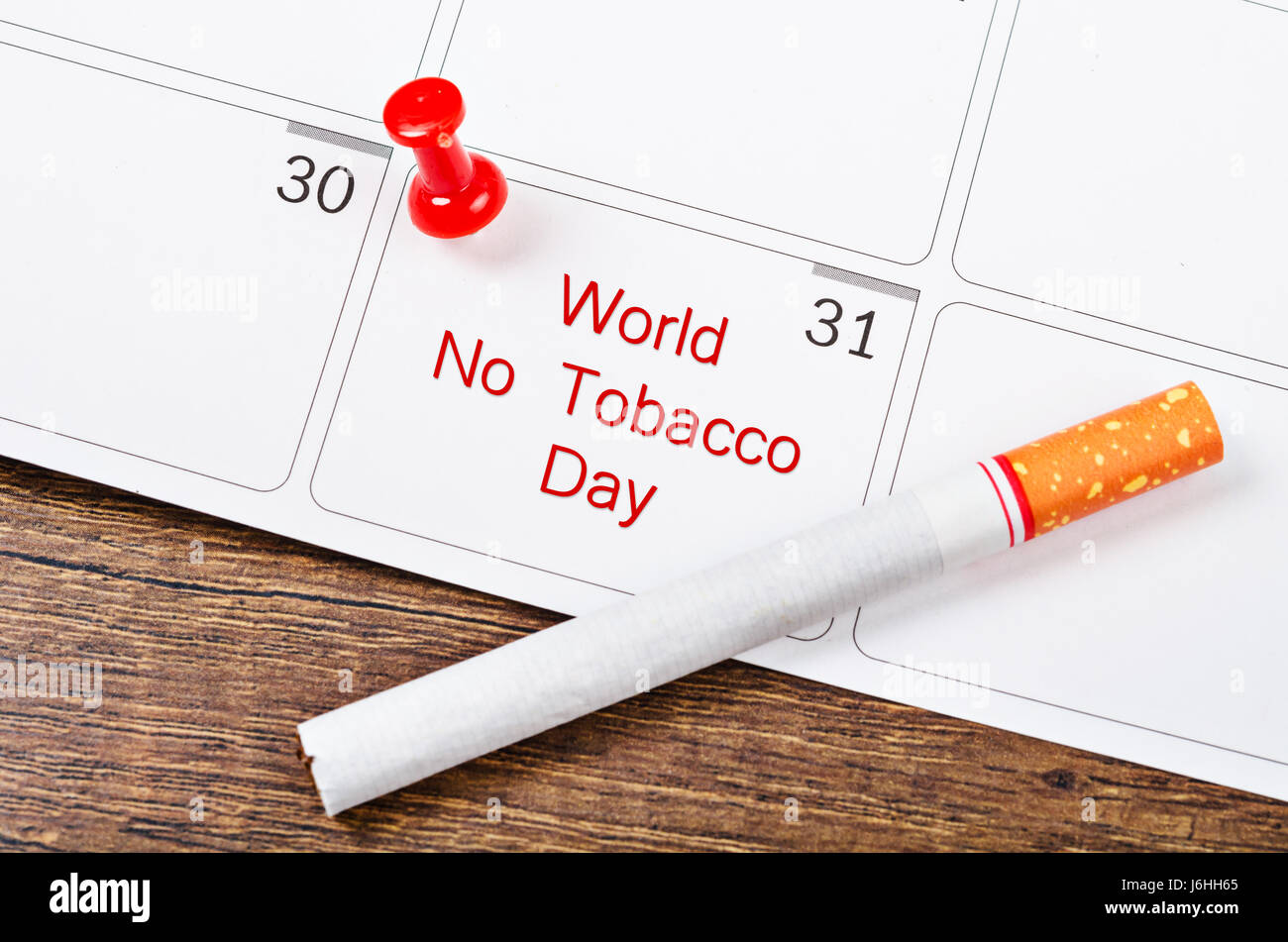 Push pins marked date on calendar 31th May with tobacco. World No ...