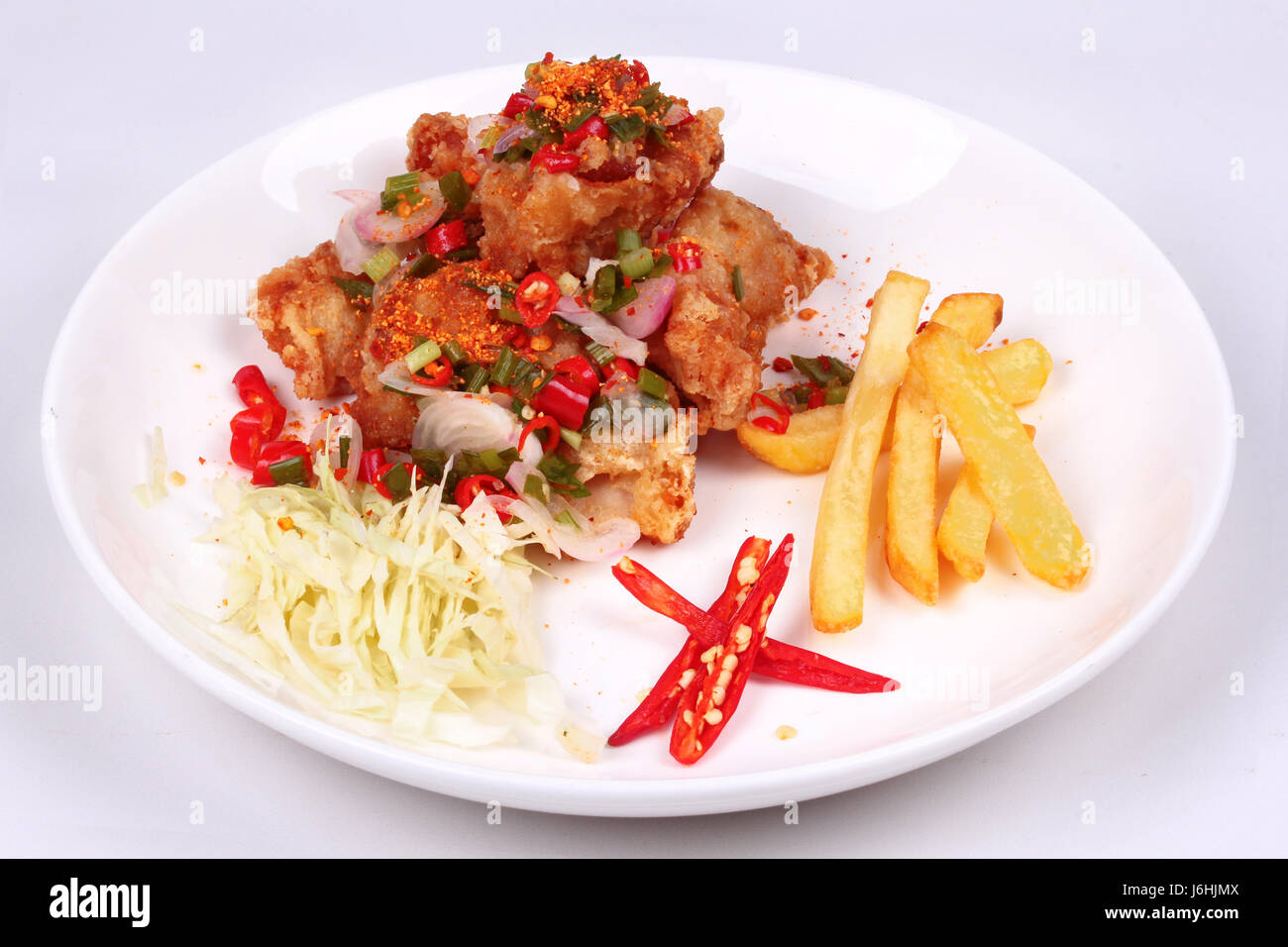 Thai spicy recipe, Spicy crispy deep-fried Karaoge chicken salad call Yum Kai Zap in Thai topped ...