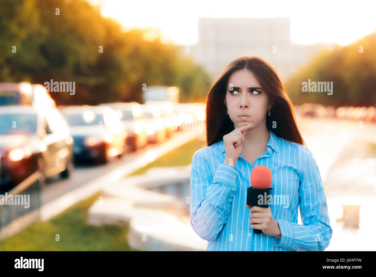 Surprised Female Reporter on Field in Traffic Stock Photo - Alamy