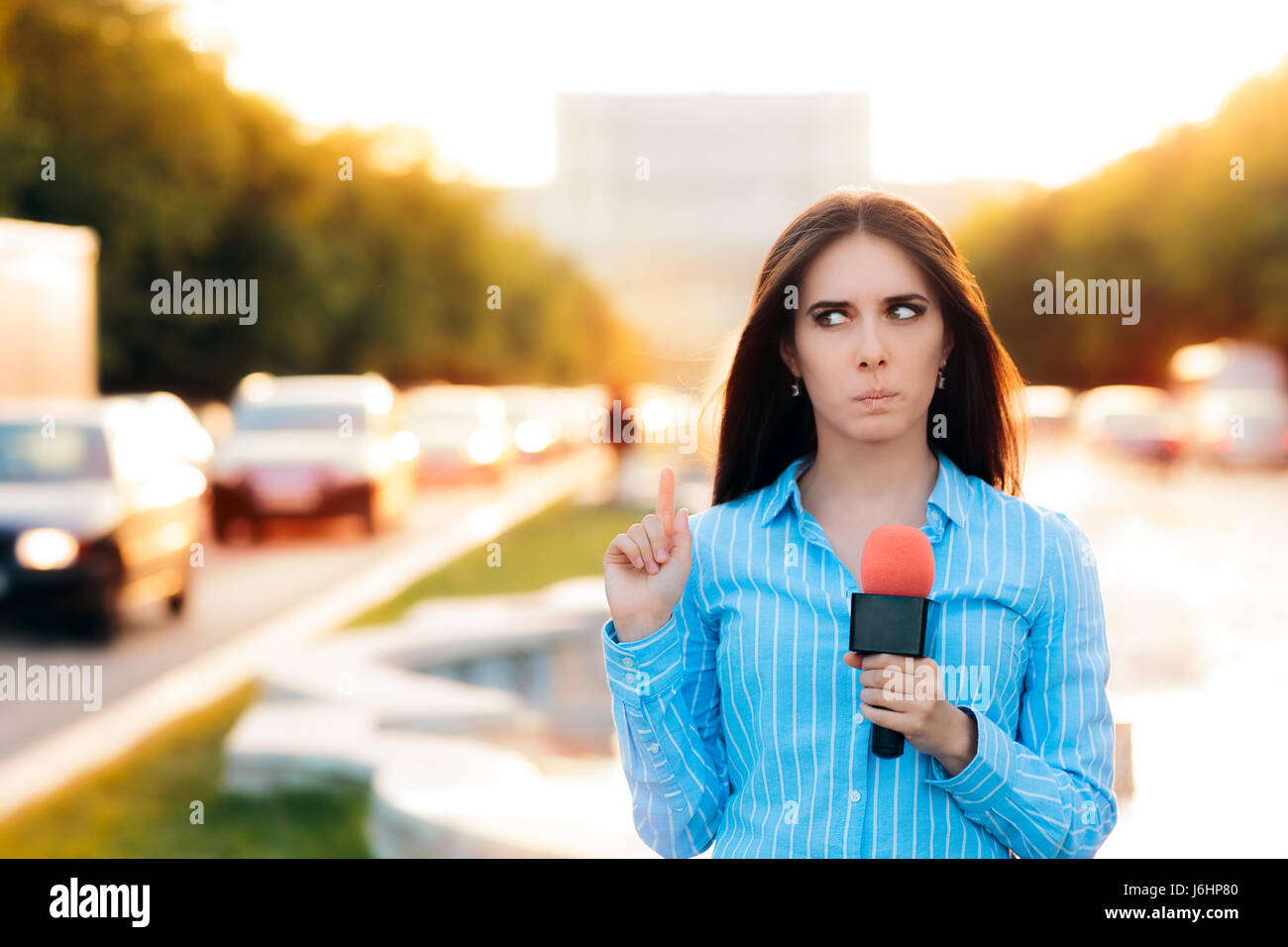 Surprised Female Reporter on Field in Traffic Stock Photo - Alamy