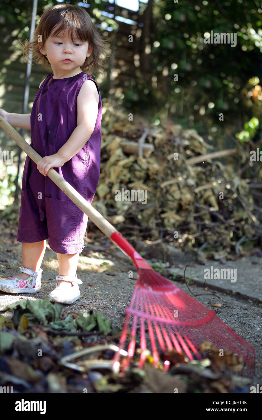 Child sweeping garden hi-res stock photography and images - Alamy