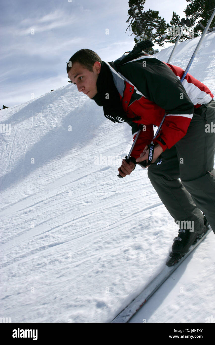 profile ski skiing skier young younger outdoors man on vacation to snow ...