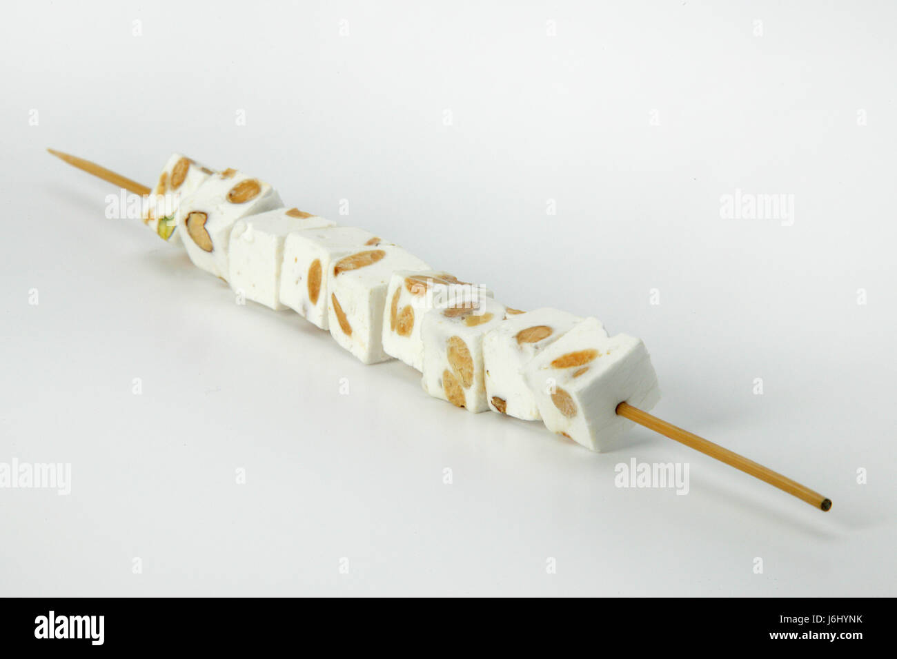 gourmet,candy,brochette nougats white,white background Stock Photo - Alamy