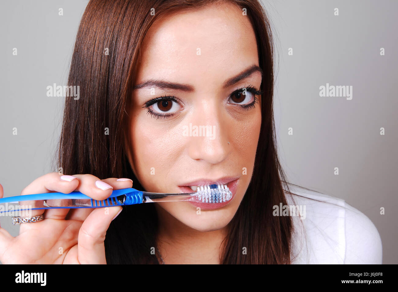 woman mouth teeth portrait vertical brushing brush woman indicate show ...