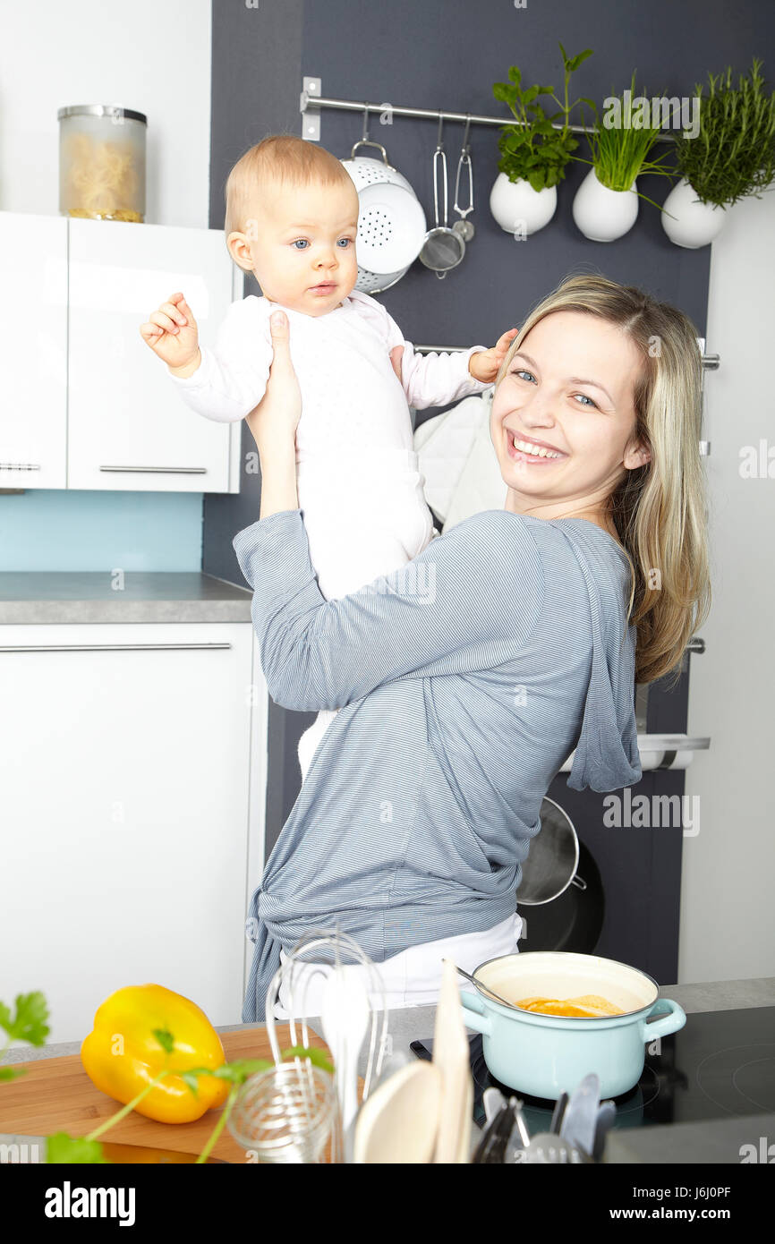 woman baby kitchen cuisine boil cooks boiling cooking mother mom ma ...