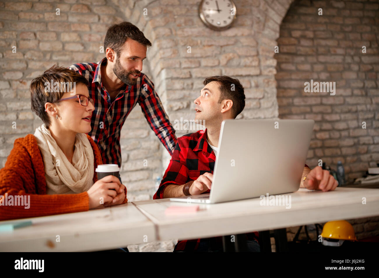 graphic designers meeting -team working together Stock Photo - Alamy