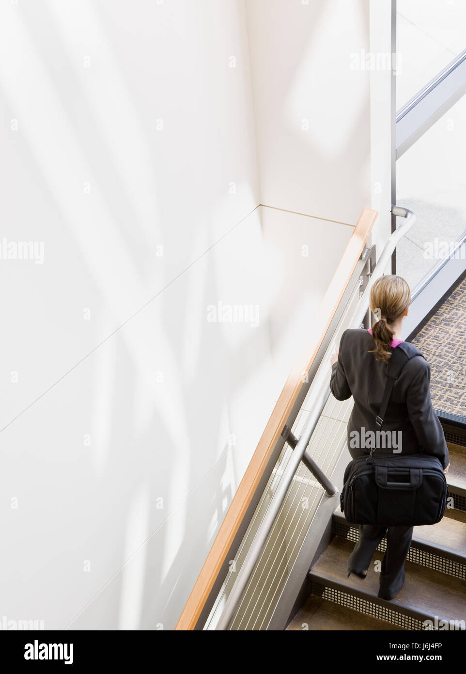 woman stairs office walk go going walking successful succesful inside ...