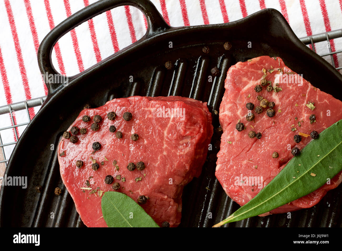 Raw beef eye fillet steak and peppercorns Stock Photo - Alamy