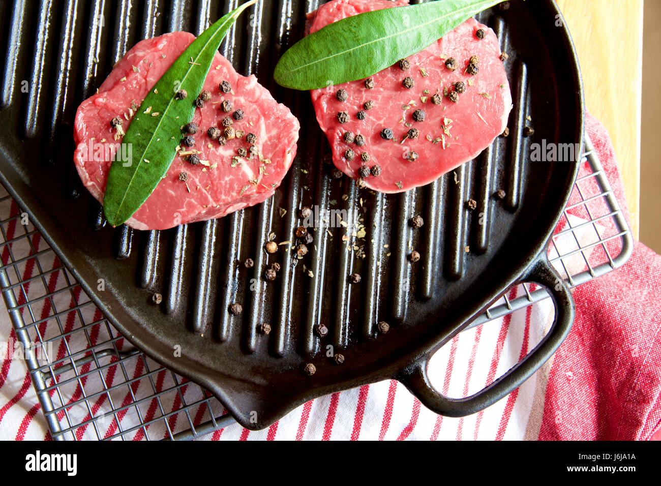 Raw beef eye fillet steak and peppercorns Stock Photo - Alamy