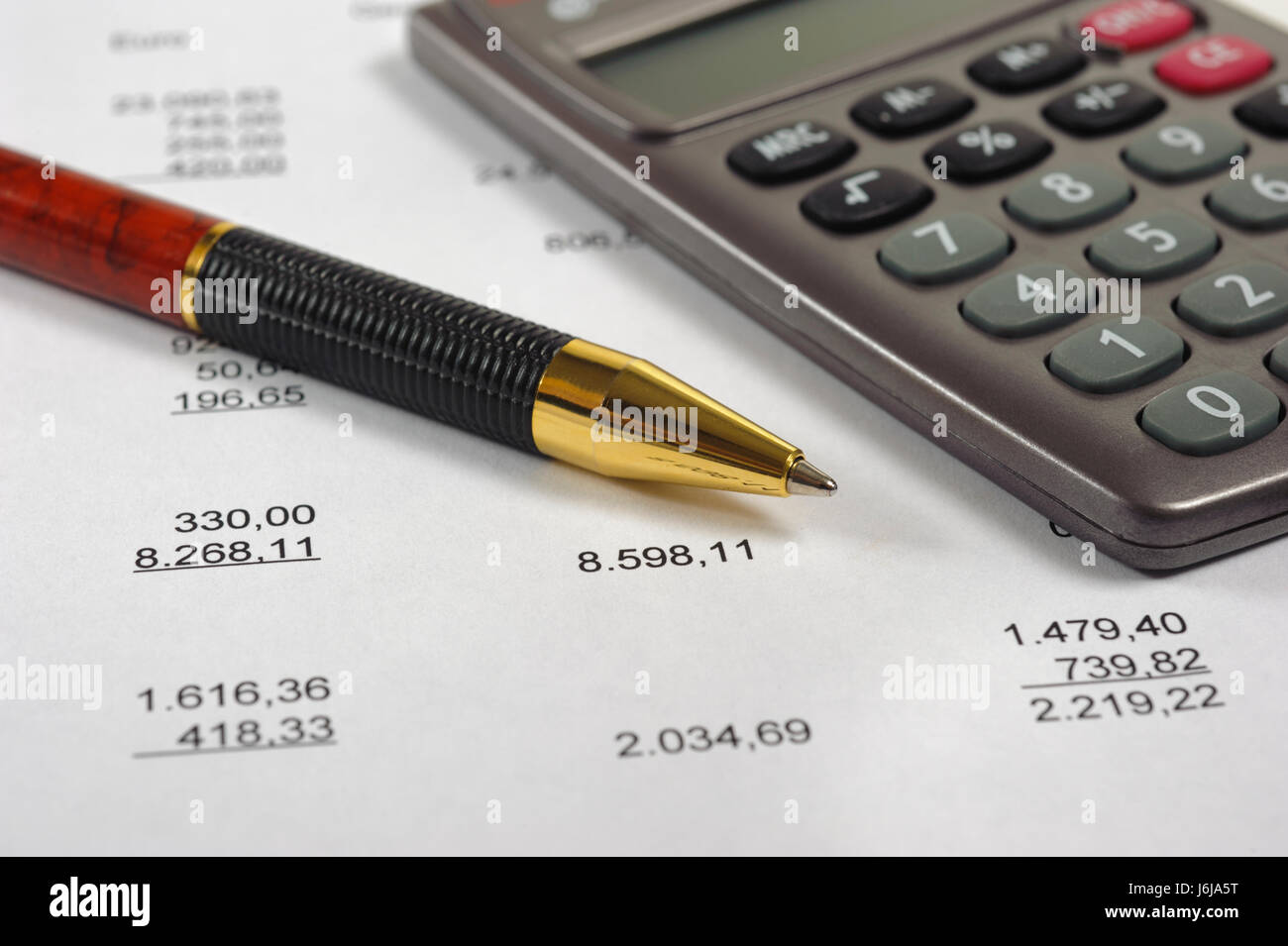 financial accounting with table sheet and calculator Stock Photo - Alamy