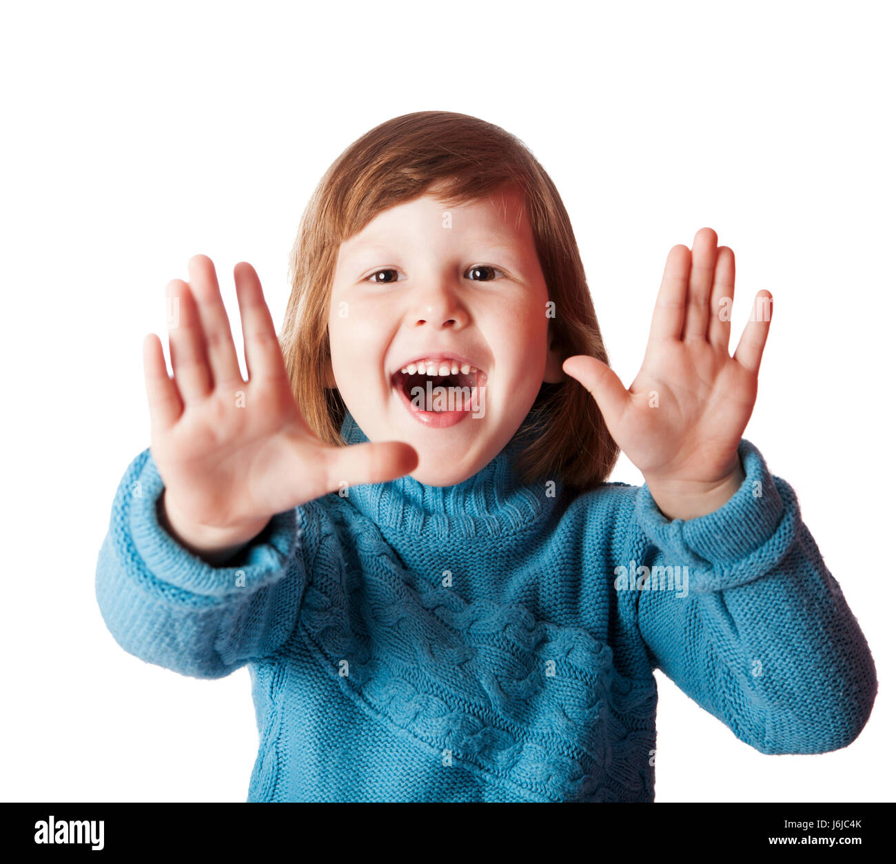 Little Girl says hi looking up wearing blue sweater Stock Photo - Alamy