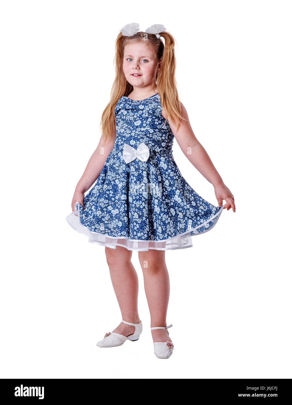 Cheerful girl spinning on floor isolated on white Stock Photo - Alamy