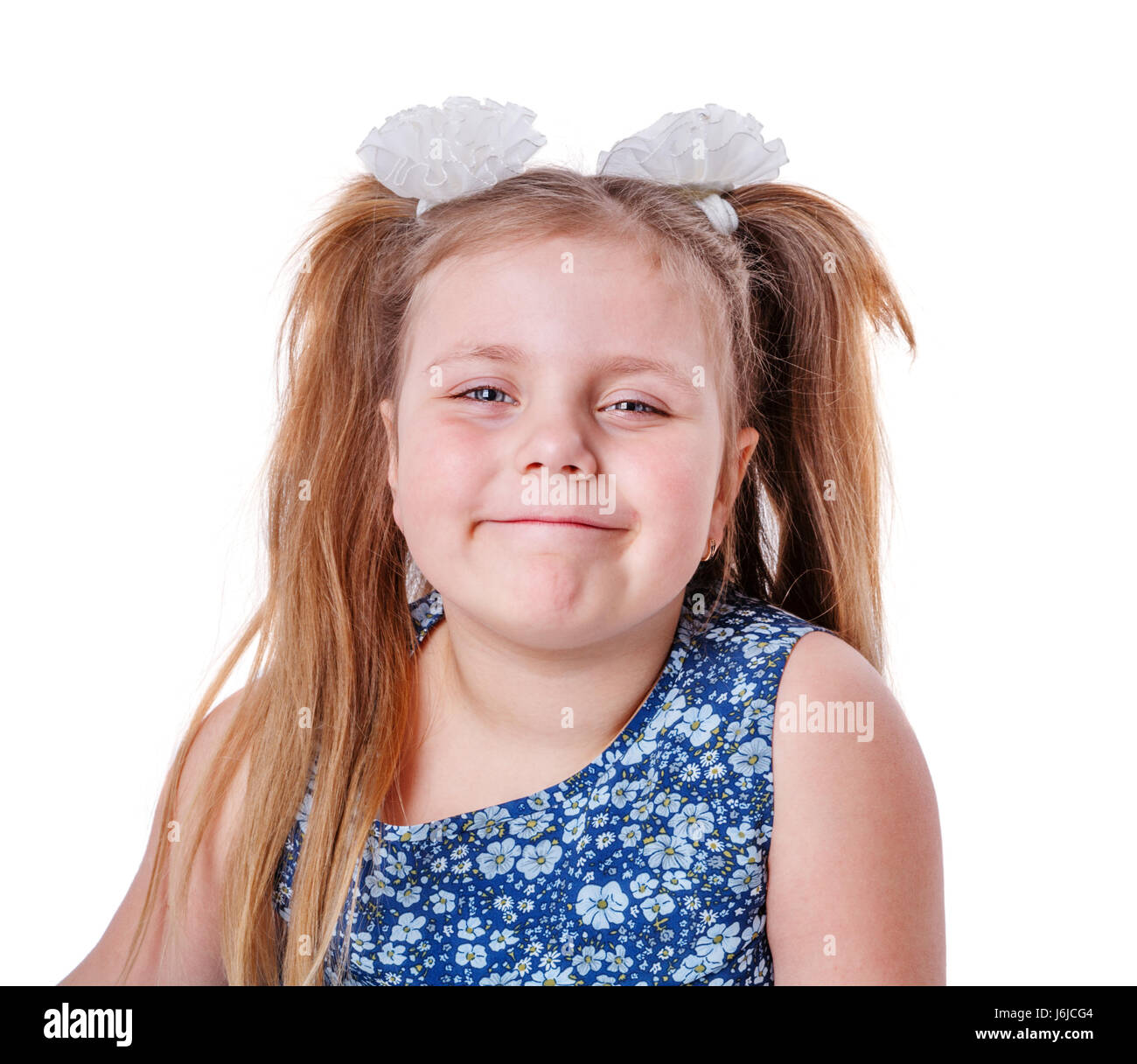 Sneaky little girl looking straight isolated on white Stock Photo - Alamy