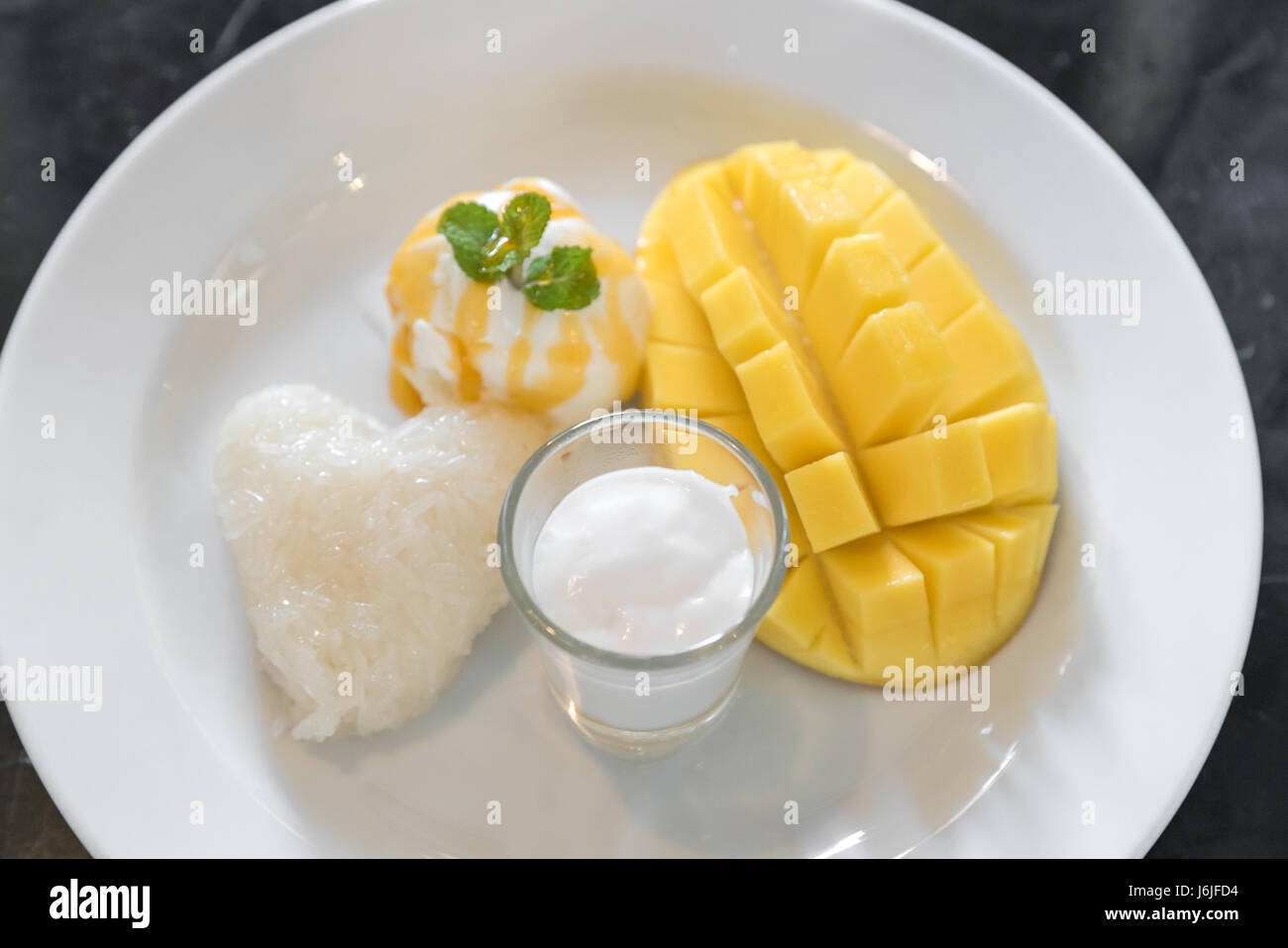 Mango with sticky rice and ice cream Stock Photo - Alamy