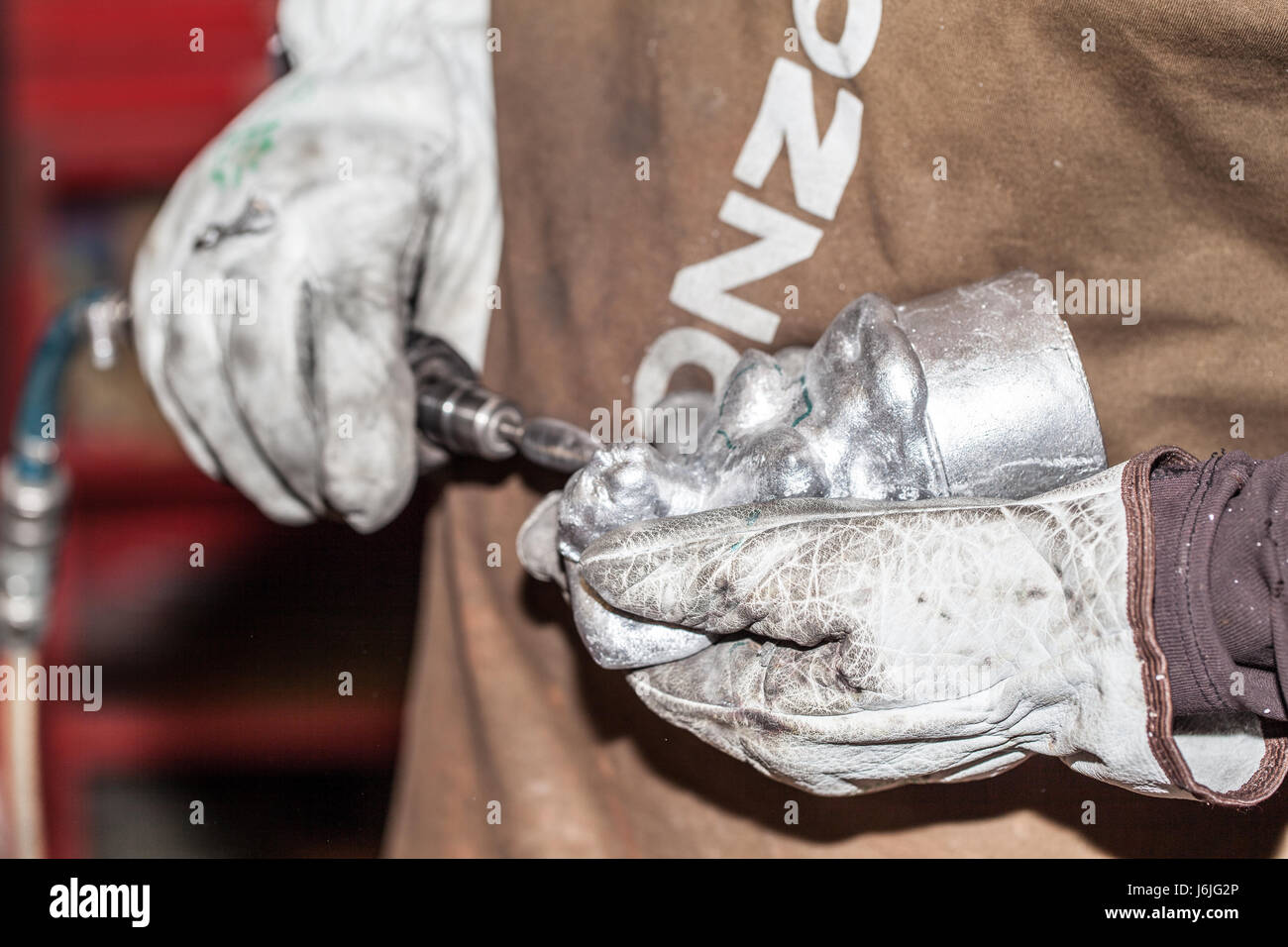 male artisan carving a a small metal sculpture Stock Photo - Alamy