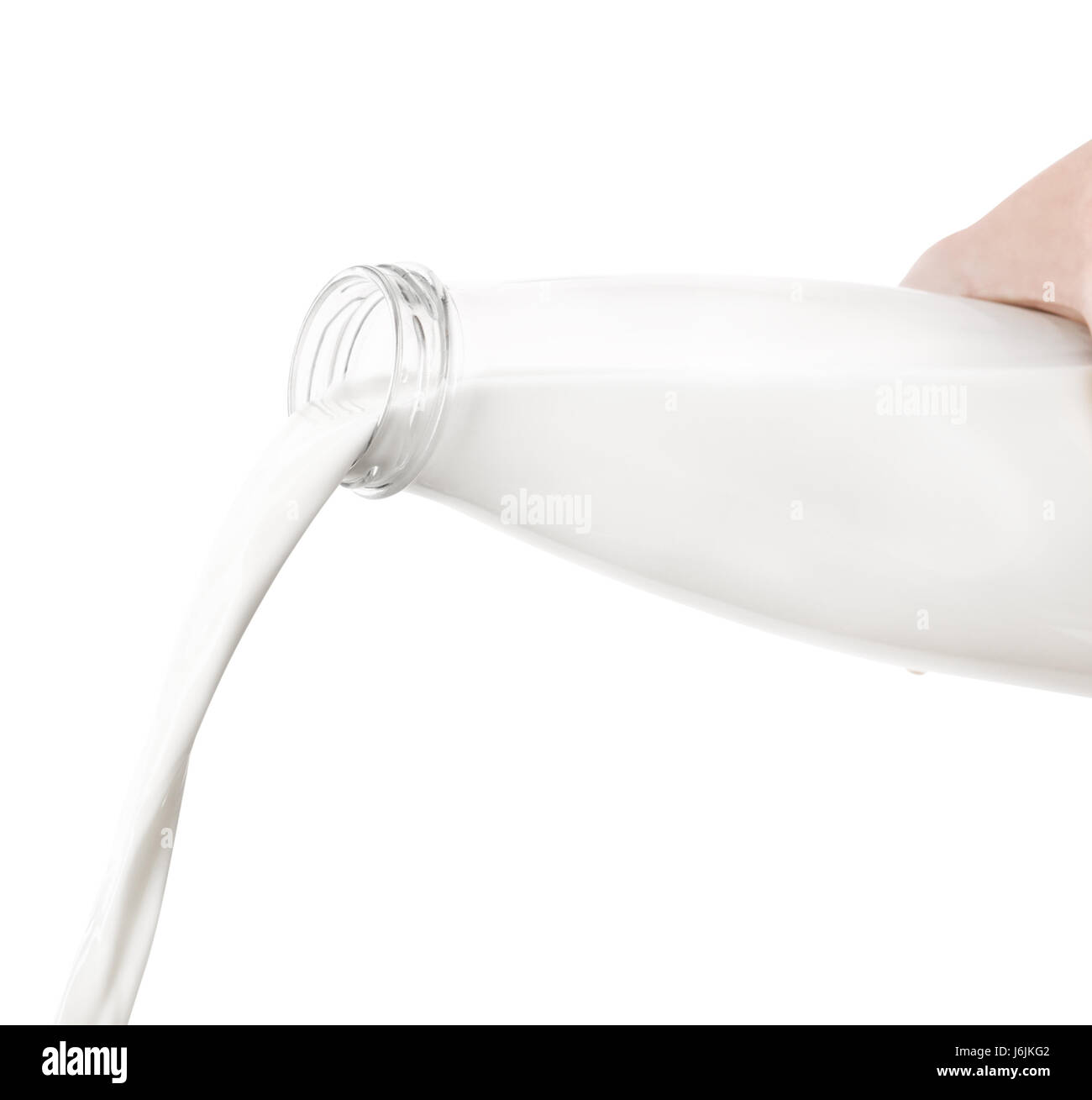 pouring milk from bottle isolated on white background Stock Photo - Alamy