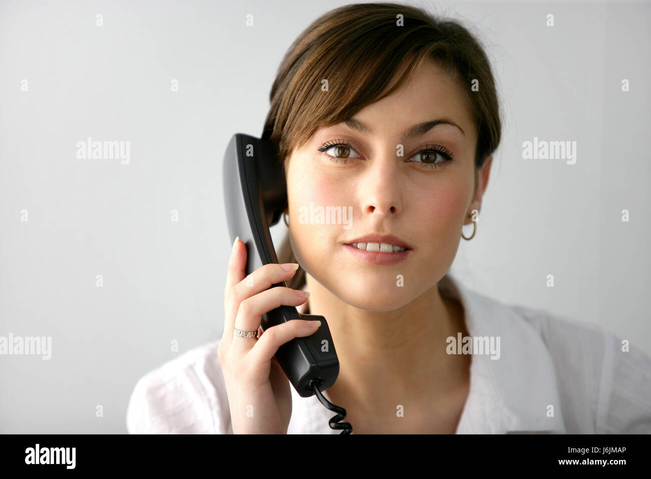 woman telephone phone portrait front view telephones appeal calling telephony Stock Photo - Alamy