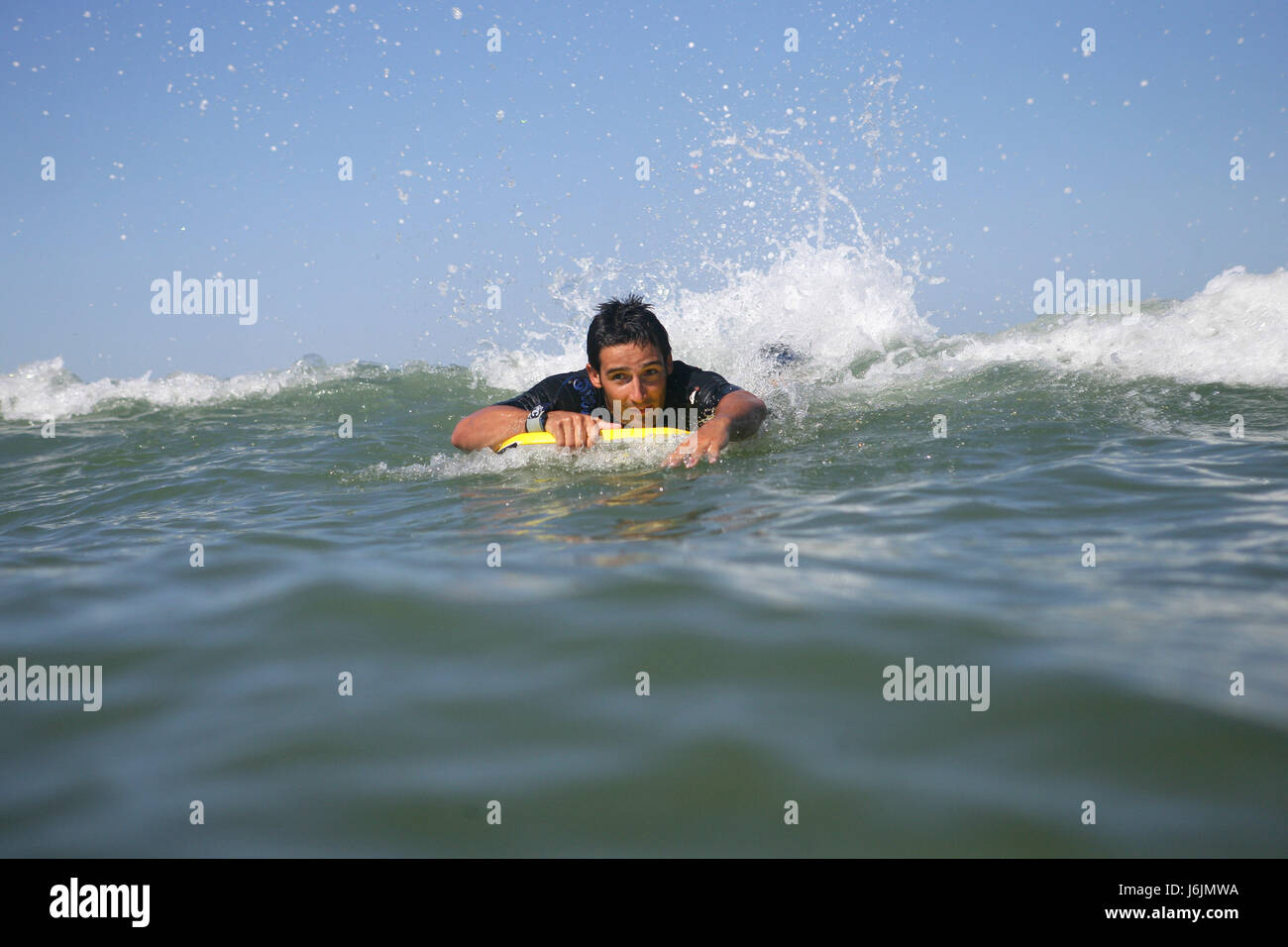 sport sports brown brownish brunette front view surfing surfer man at ...