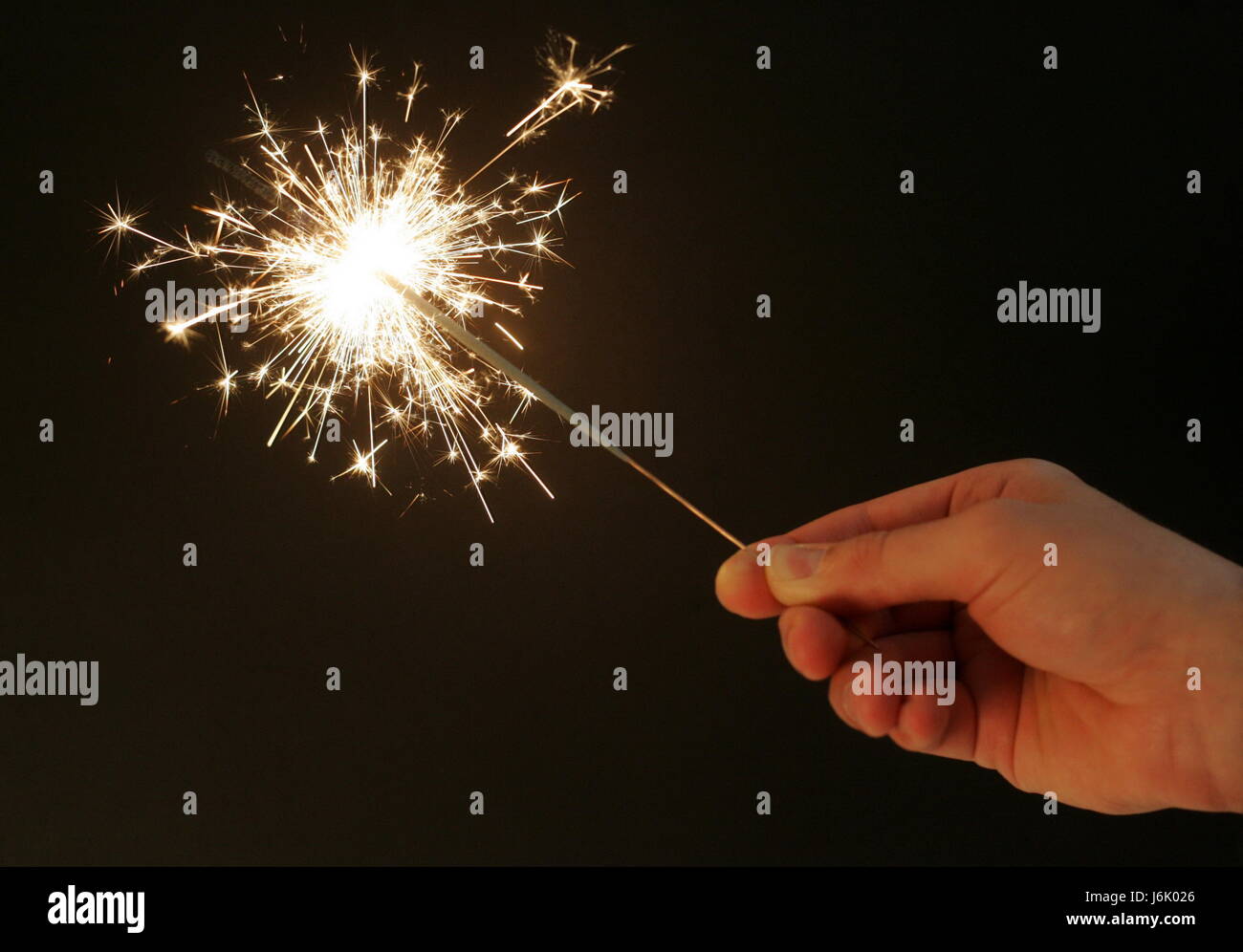hand with burning sparkler Stock Photo - Alamy