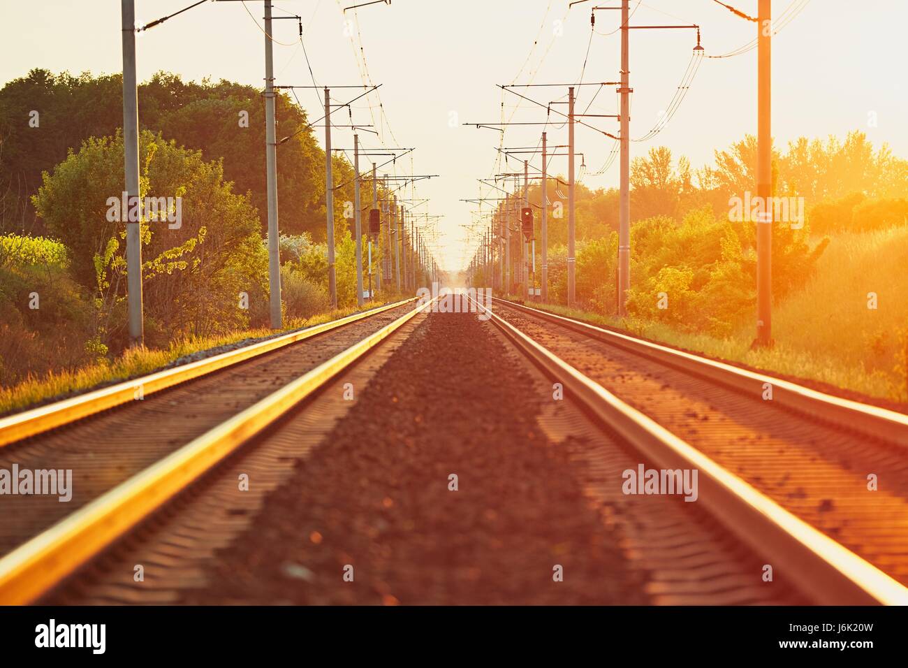 Railway at the amazing sunset (golden hour). Modern railroad track in ...