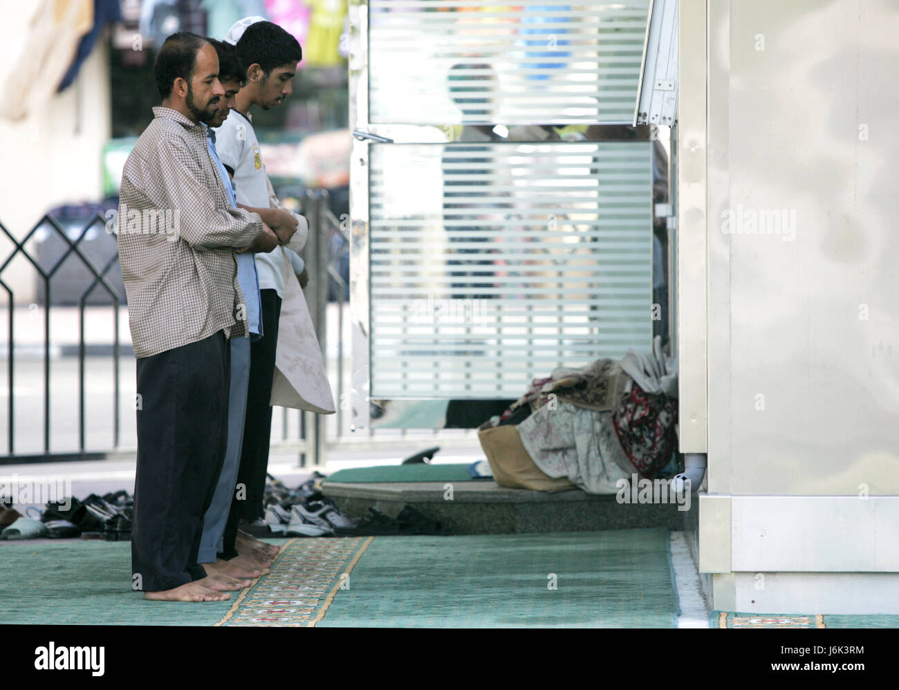 DUBAI, UNITED ARAB EMIRATES - 21 FEBRUARY 2005: Muslims during prayer ...