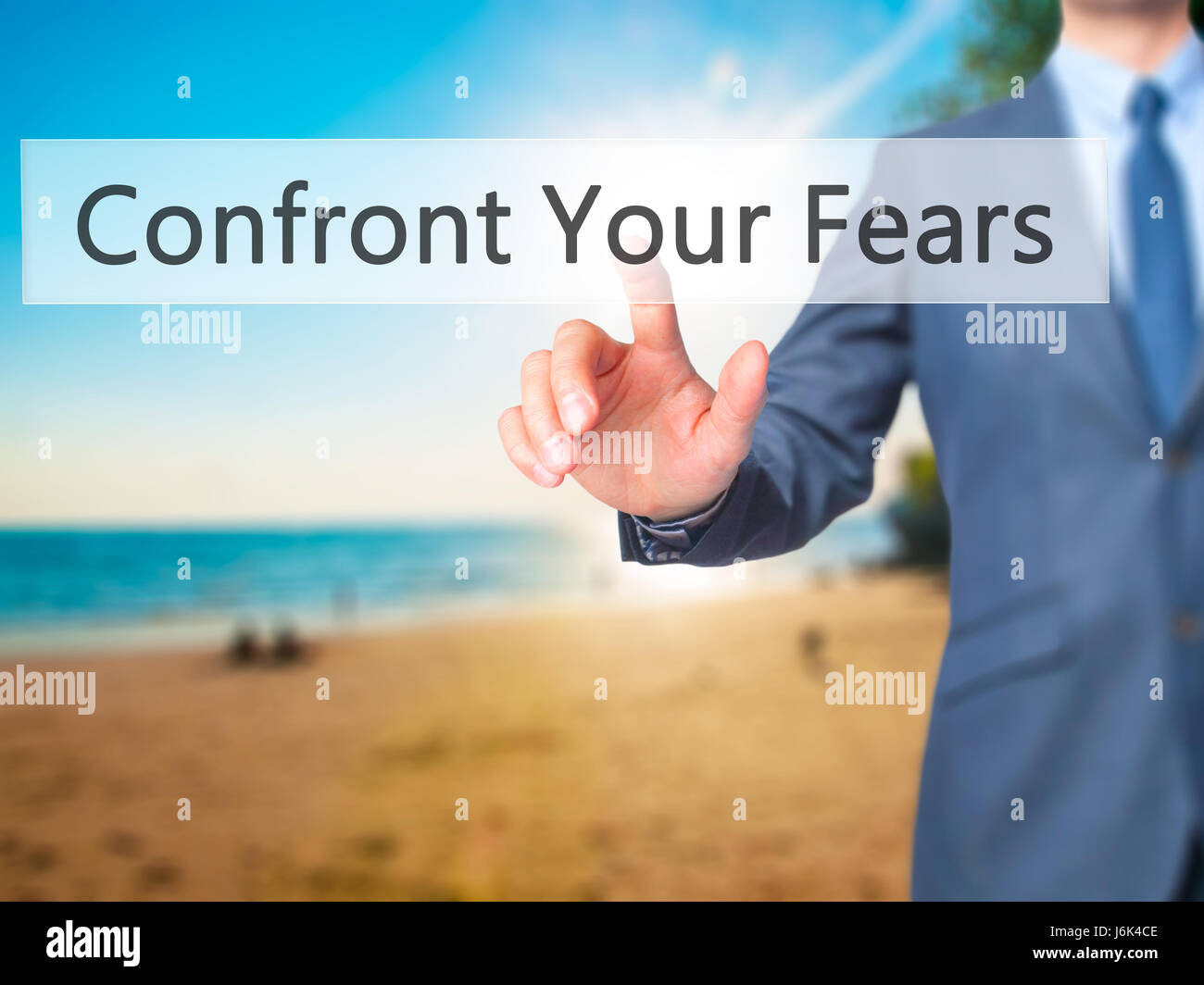 Confront Your Fears - Businessman click on virtual touchscreen ...