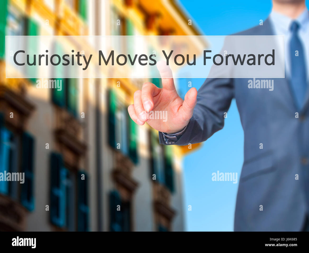 Curiosity Moves You Forward - Businessman hand pushing button on touch ...