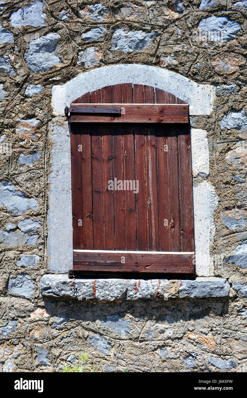 stone window porthole dormer window pane wood rock wall closed rustical ...