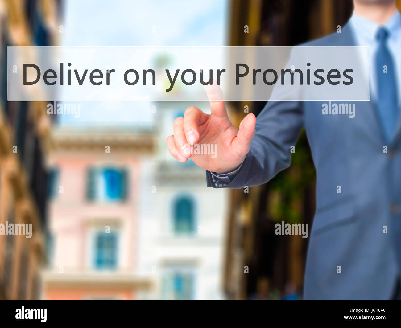 Deliver on your Promises - Businessman hand pushing button on touch ...