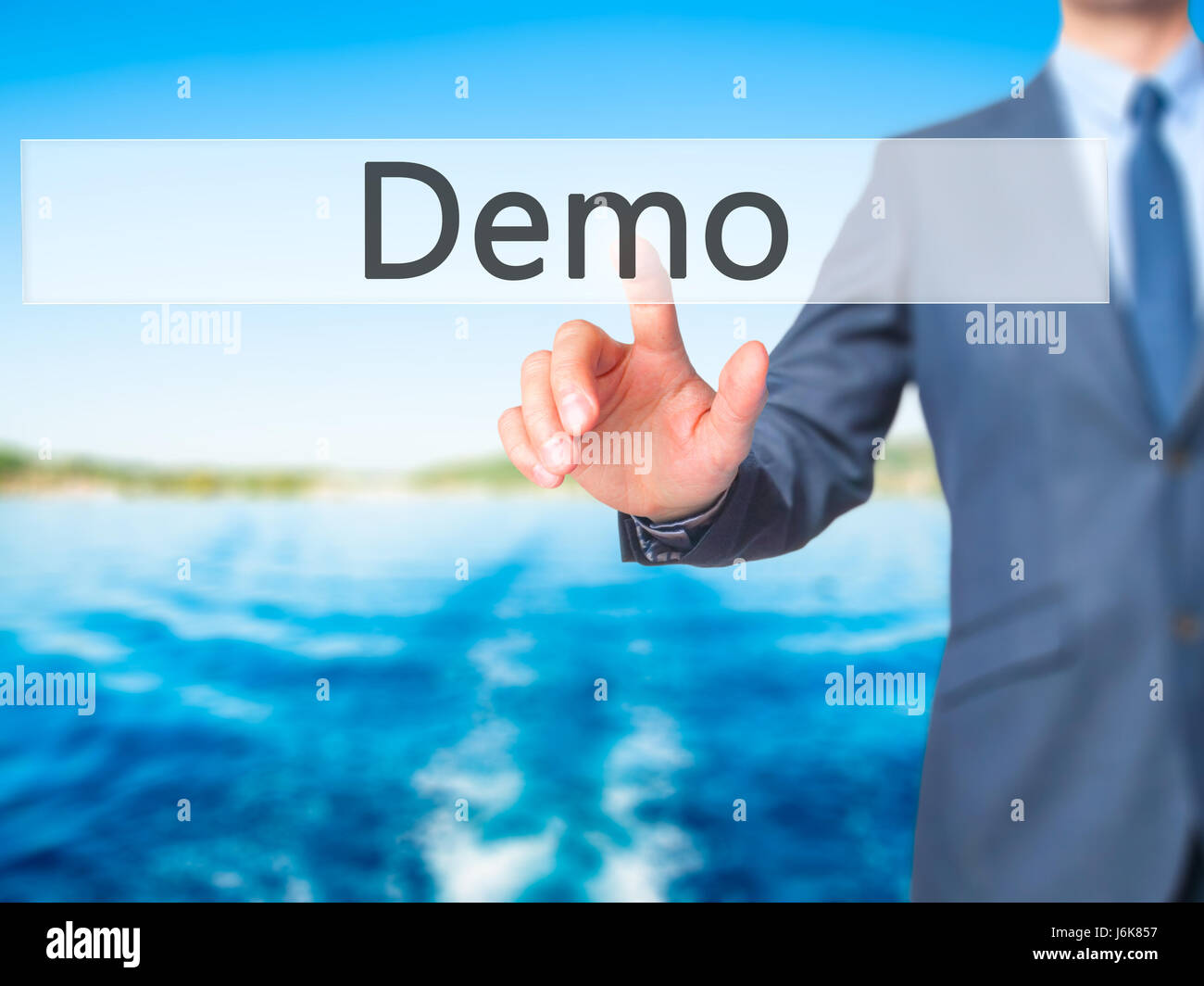 Demo - Businessman hand pushing button on touch screen. Business ...