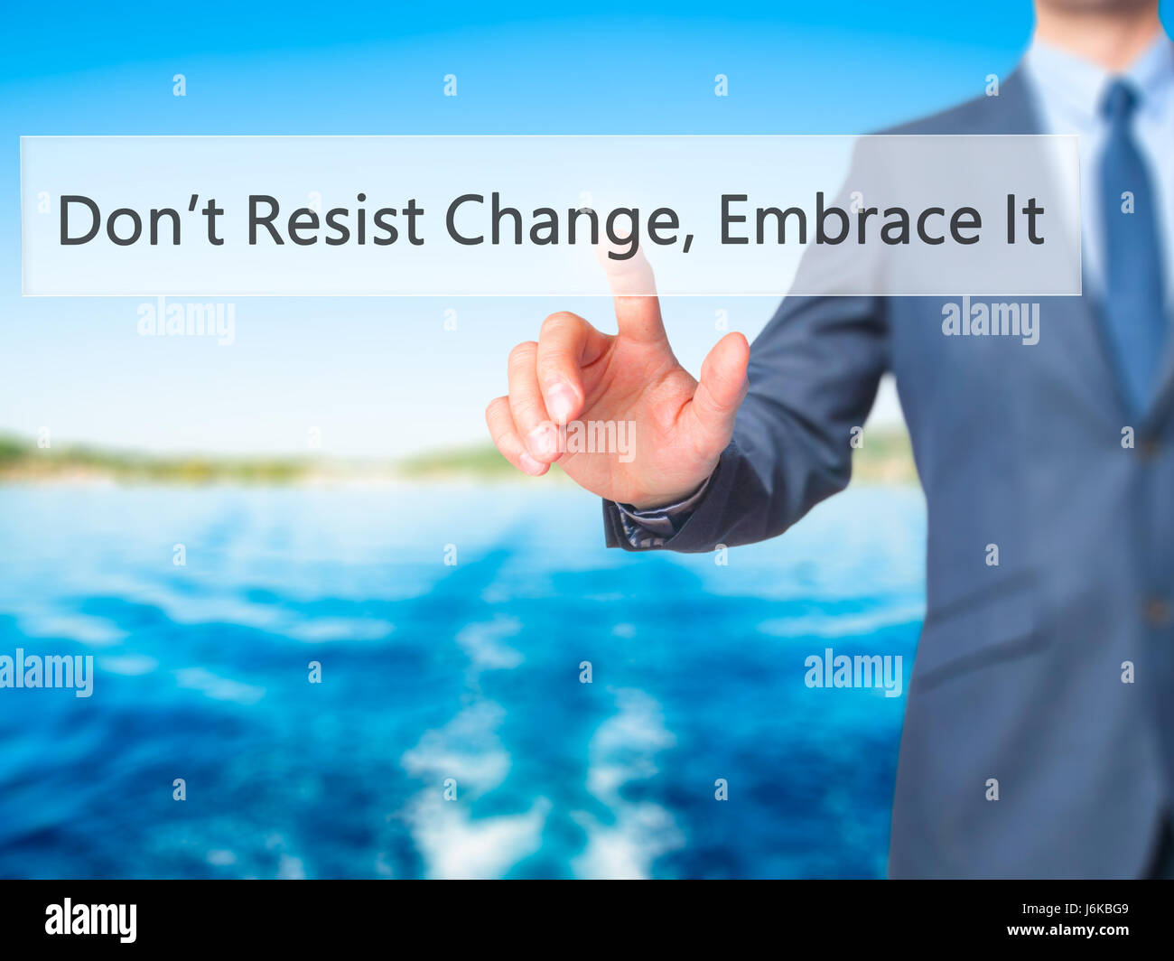 Don't Resist Change, Embrace It! - Businessman hand pressing button on ...