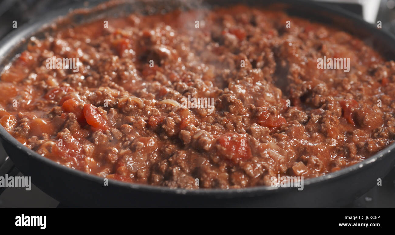 roasting minced beef with tomato paste in a pan, wide photo Stock Photo ...
