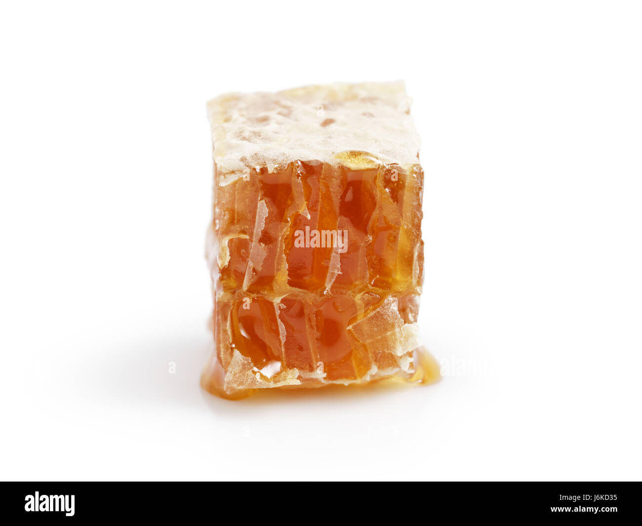 small piece of honeycomb isolated on white background Stock Photo - Alamy