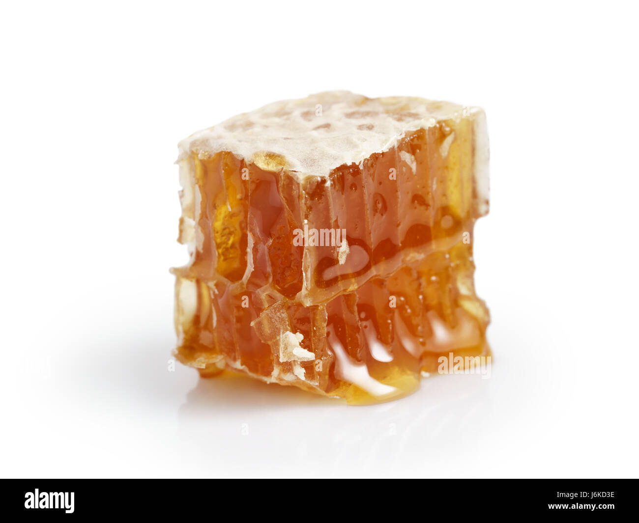 small piece of honeycomb isolated on white background Stock Photo - Alamy