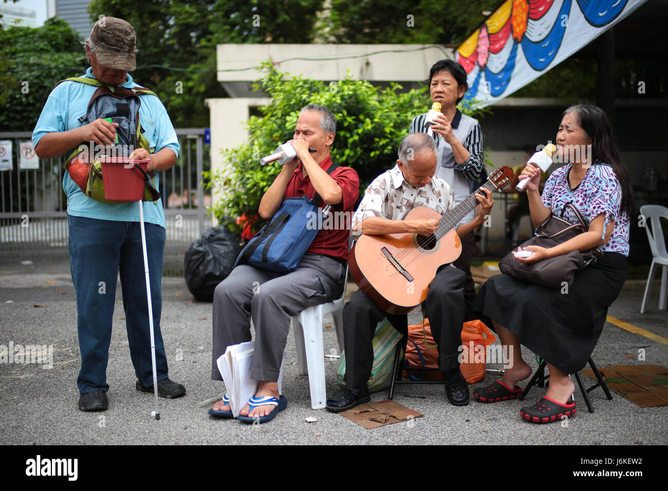 KL, MALAYSIA - 10 MAY 2017 : Five blind old folks performing their song ...