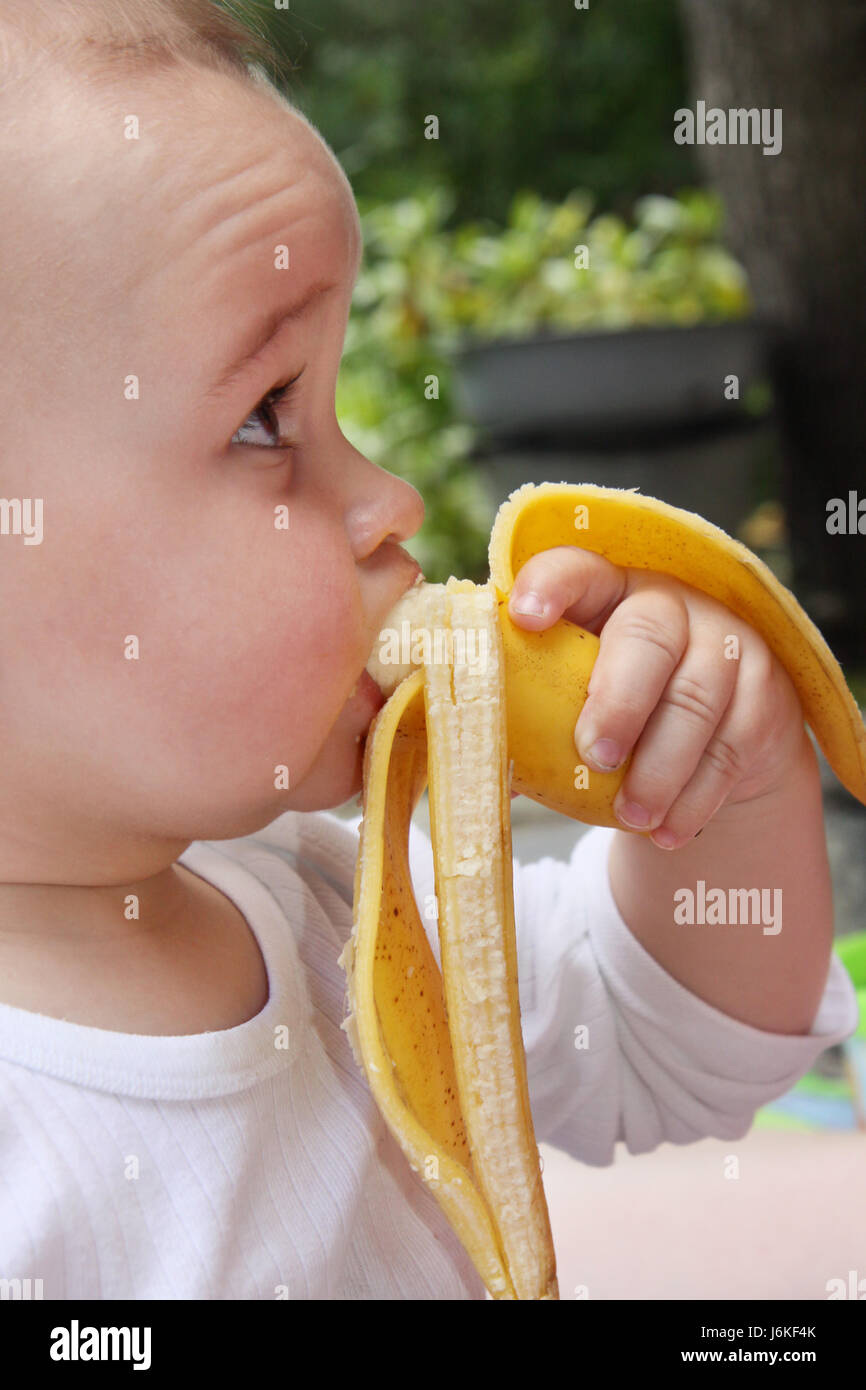 food aliment baby banana child eating eat eats children kids humans ...