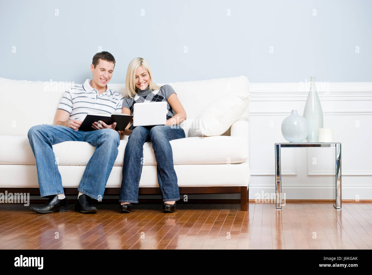 woman couch technology couple pair computers computer man woman humans ...