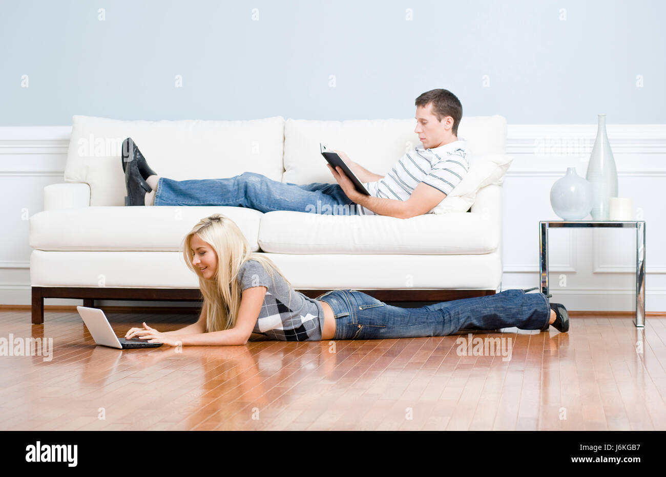 woman couch technology couple pair computers computer man woman humans ...
