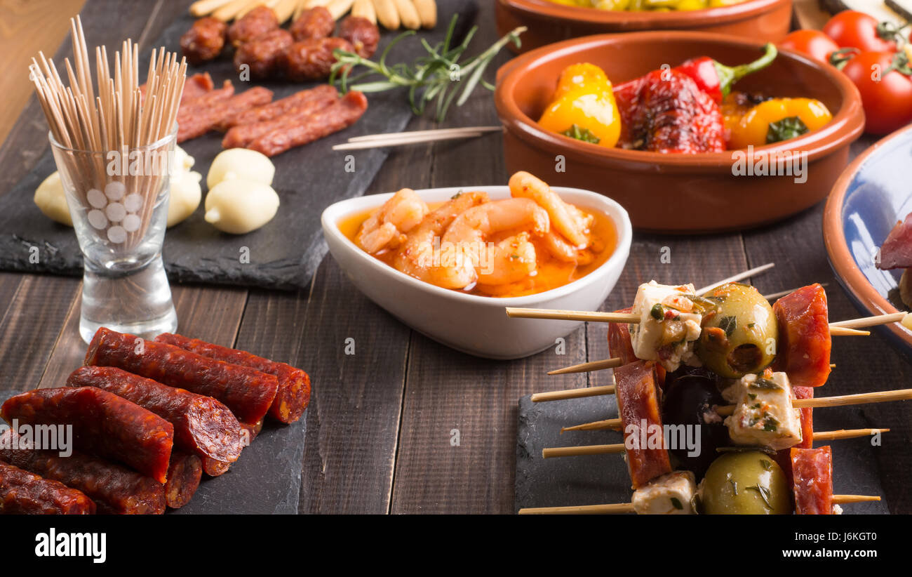 Mediterranean cuisine. Spanish tapas starters on wooden table ...