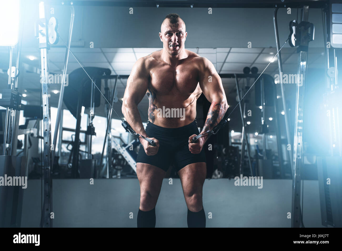 Weightlifting power training in sport gym. Strong athlete exercise with ...
