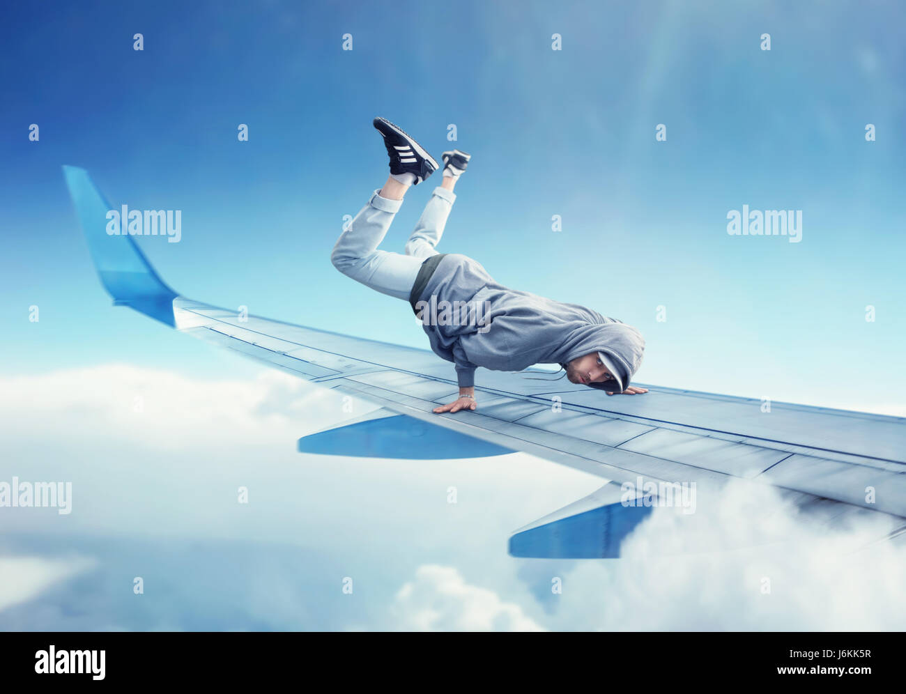Dance performer, dancing exercise on the plane wing. Modern dance style ...