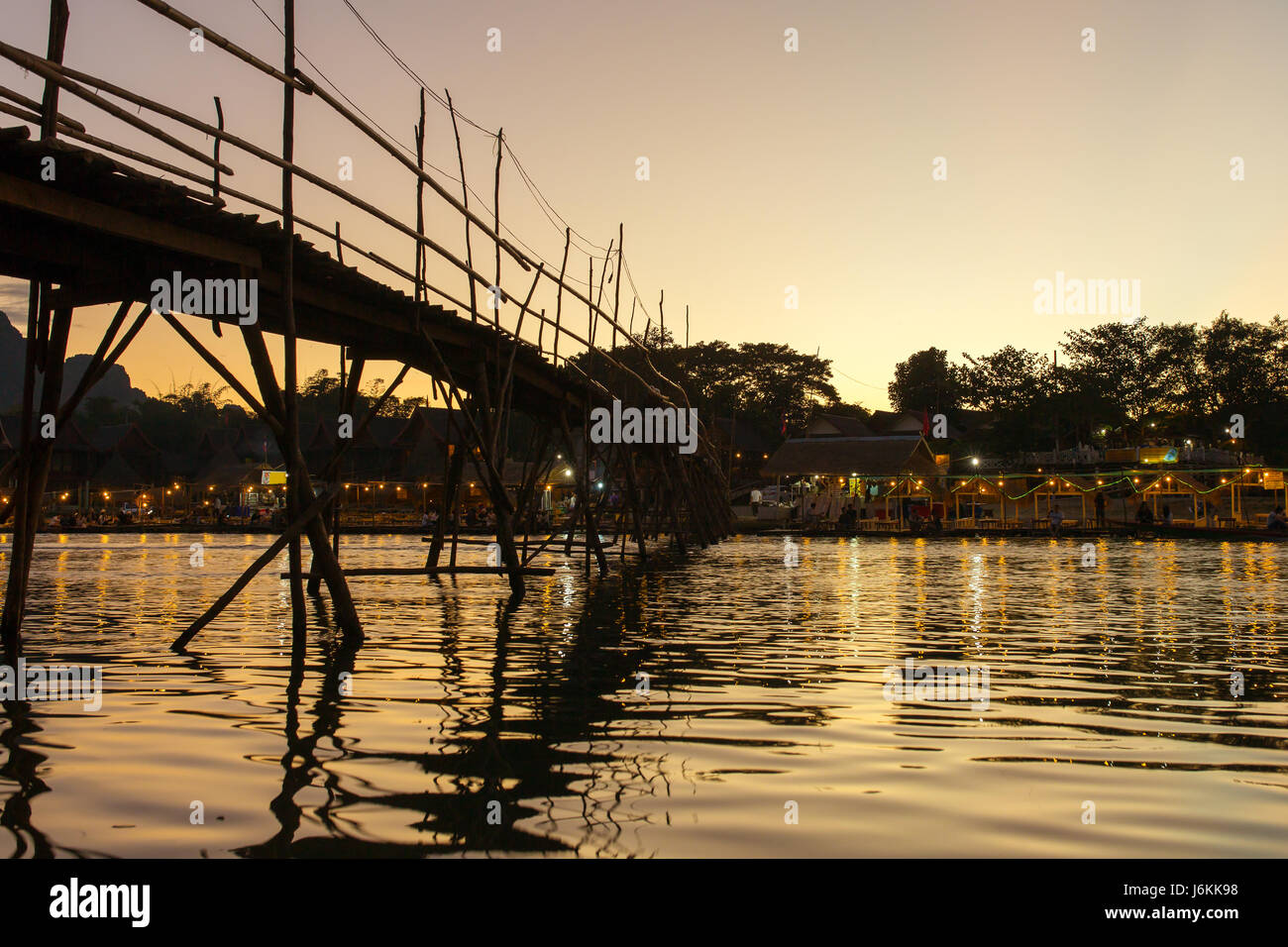 Wooden bridge across Nam Song river at Vang Vieng, Laos Stock Photo - Alamy